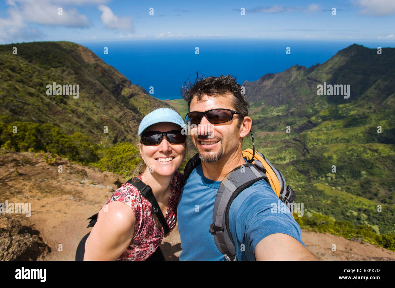 Middle aged couple taking a digital picture of themselves from a ...