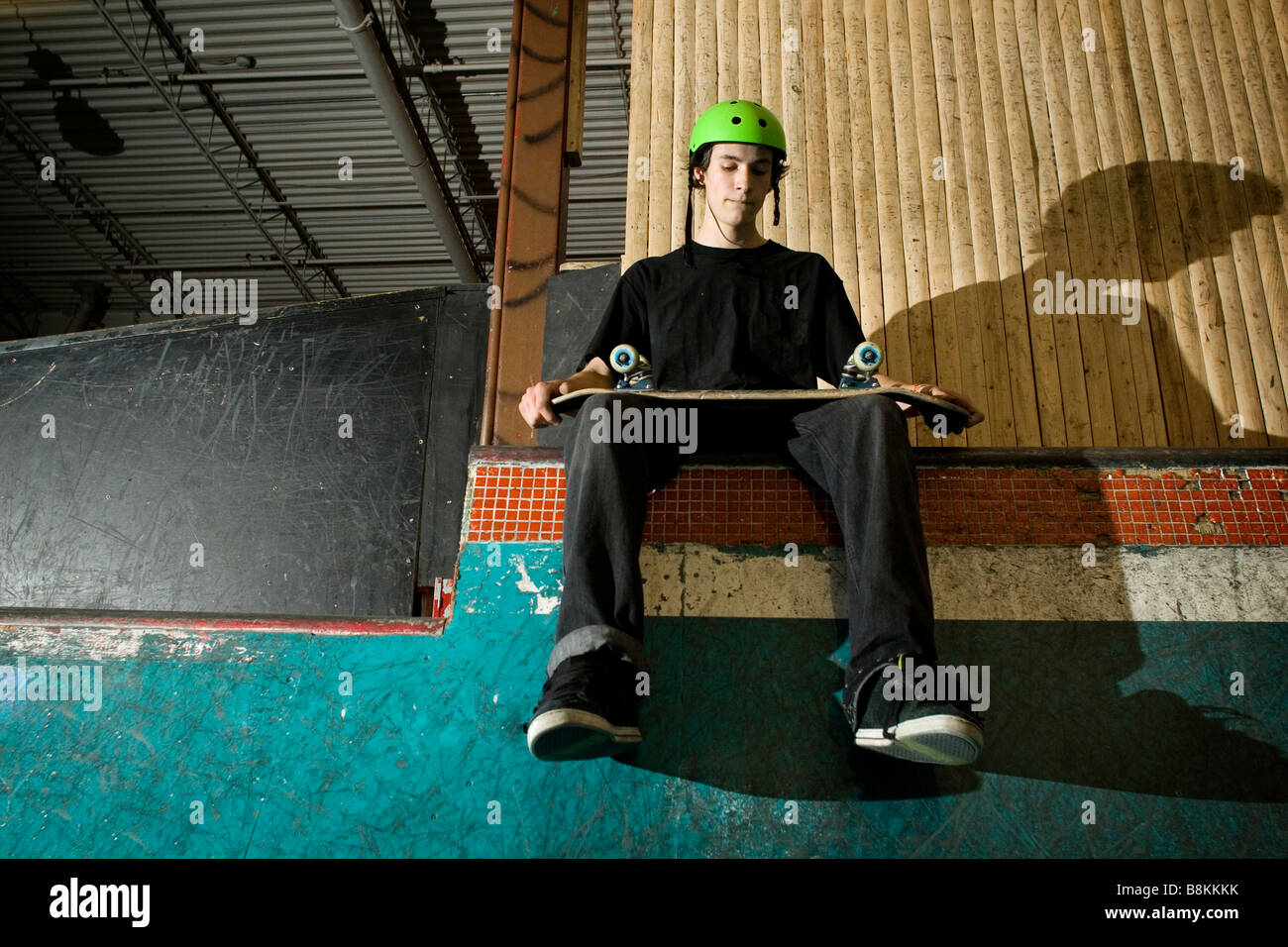 Skateboarder sitting on ramp hi-res stock photography and images - Alamy