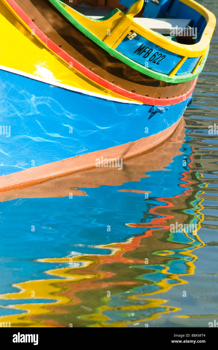 Close up of a traditional Mata fishing boat Luzzu with reflection on ...