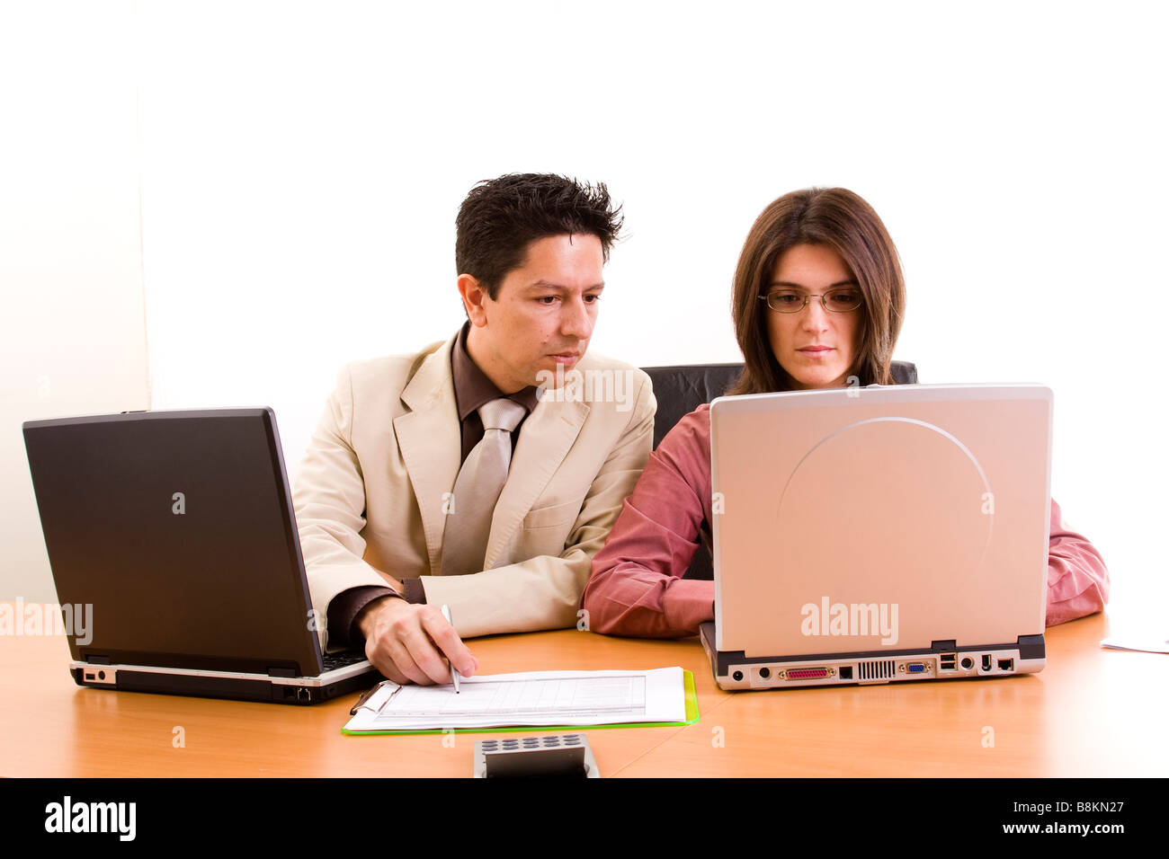 business team reviewing some documents at the office Stock Photo - Alamy