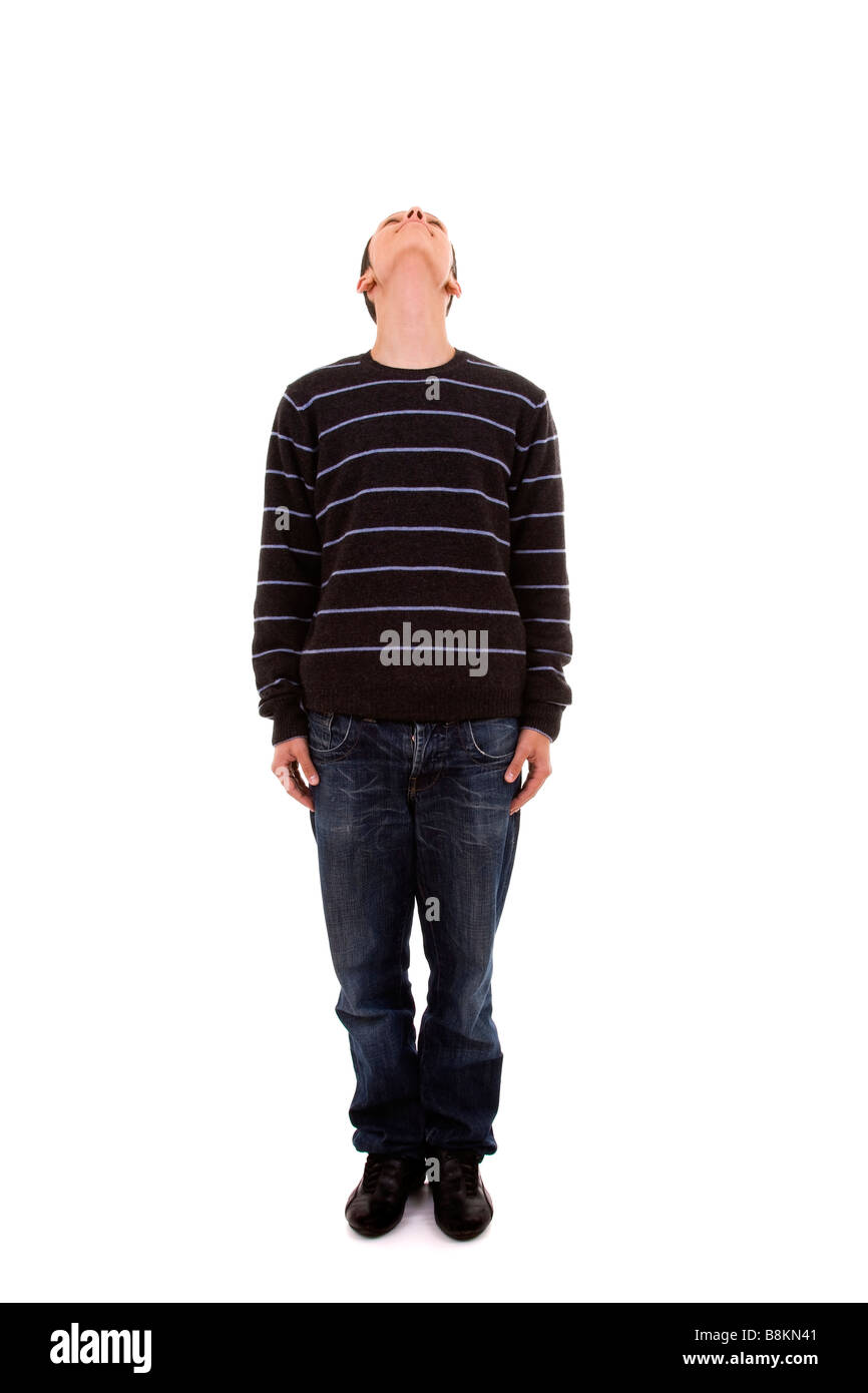 young man standing with his head looking up isolated on white Stock ...