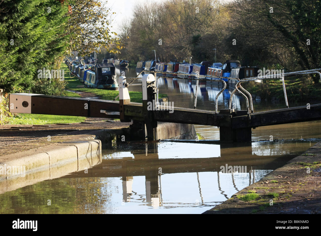 Lock gates on the Grand Union canal, near Towcester, with a line of ...