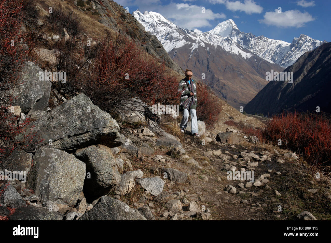 A girl walks in the Himalayan mountains around Chitkul in the Sangla ...