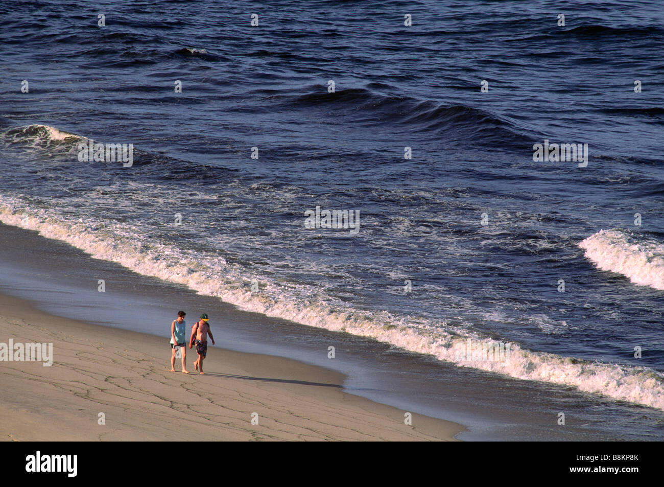 A couple walks on the beach, Cape Cod National Seashore in North Truro ...