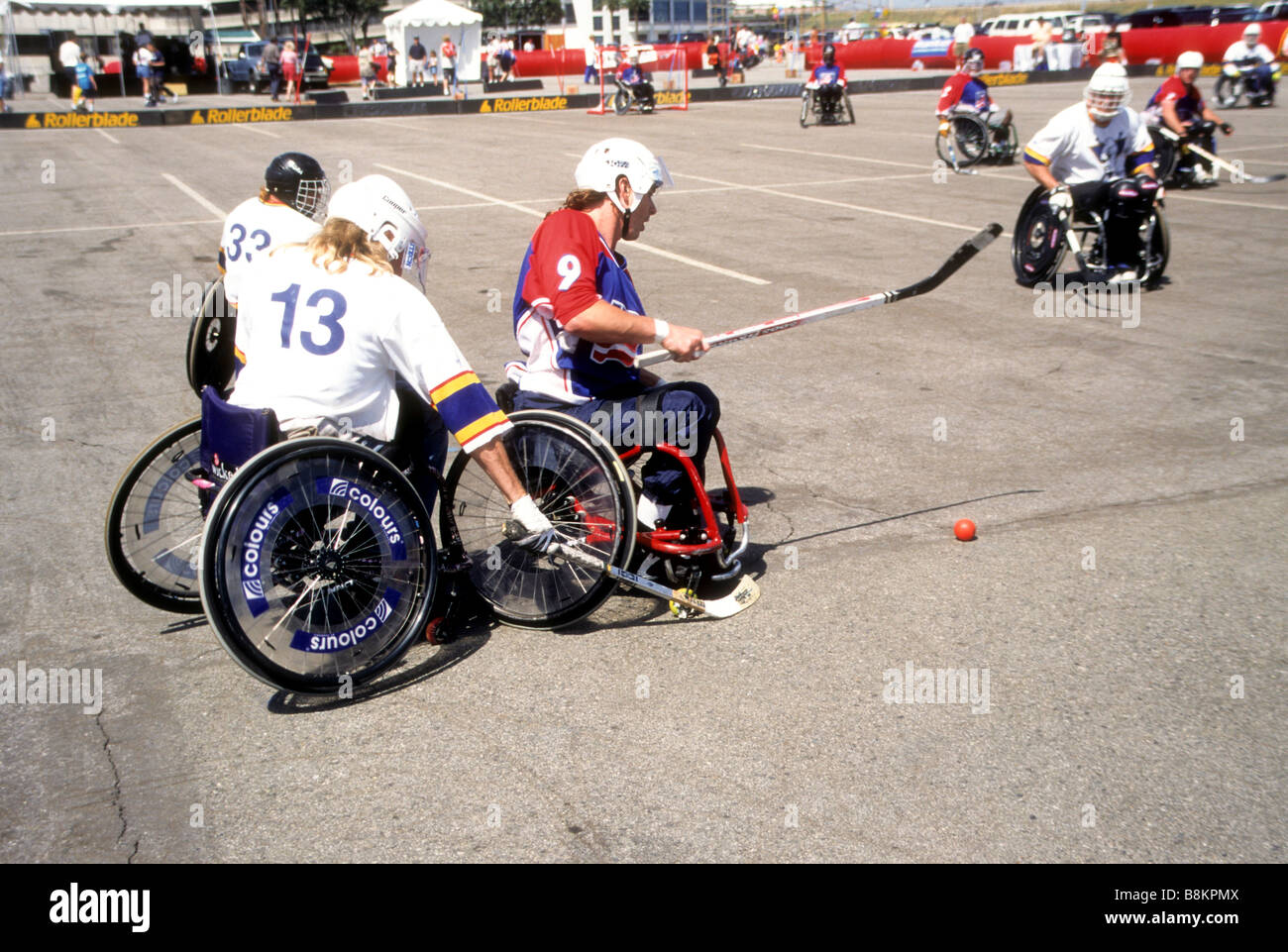 Wheelchair stick hockey game played by men on court Stock Photo - Alamy