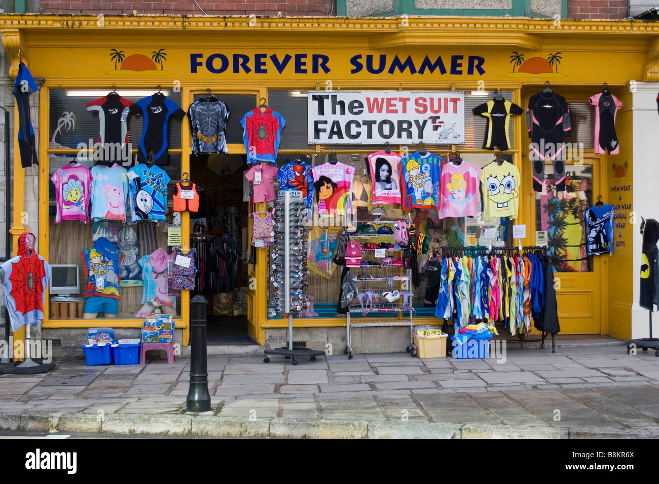 Retail store selling summer goods and wet suits Stock Photo - Alamy