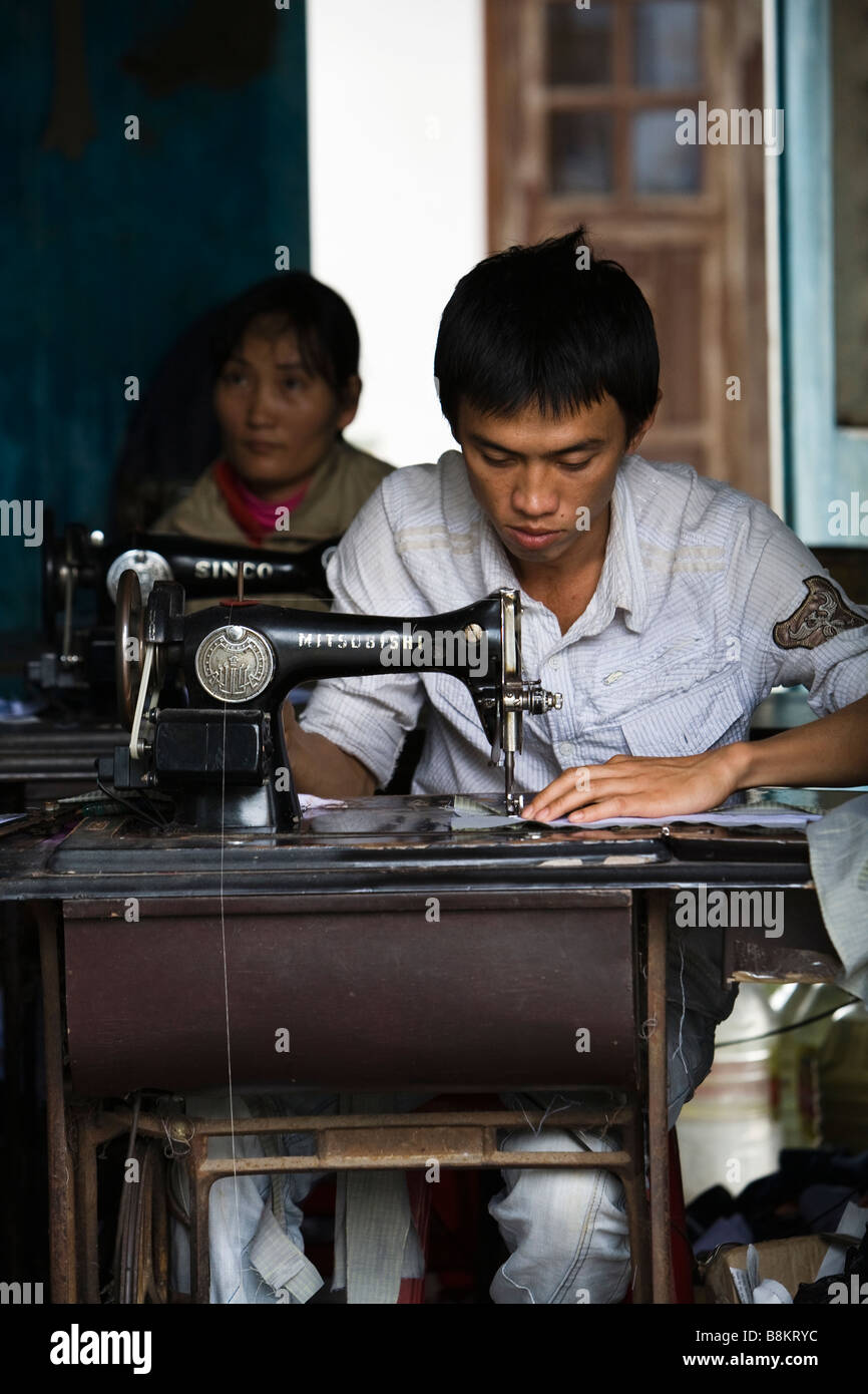 man at sewing machine Stock Photo - Alamy
