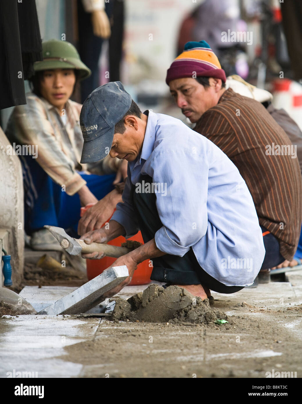 Workmen on sidewalk hi-res stock photography and images - Alamy