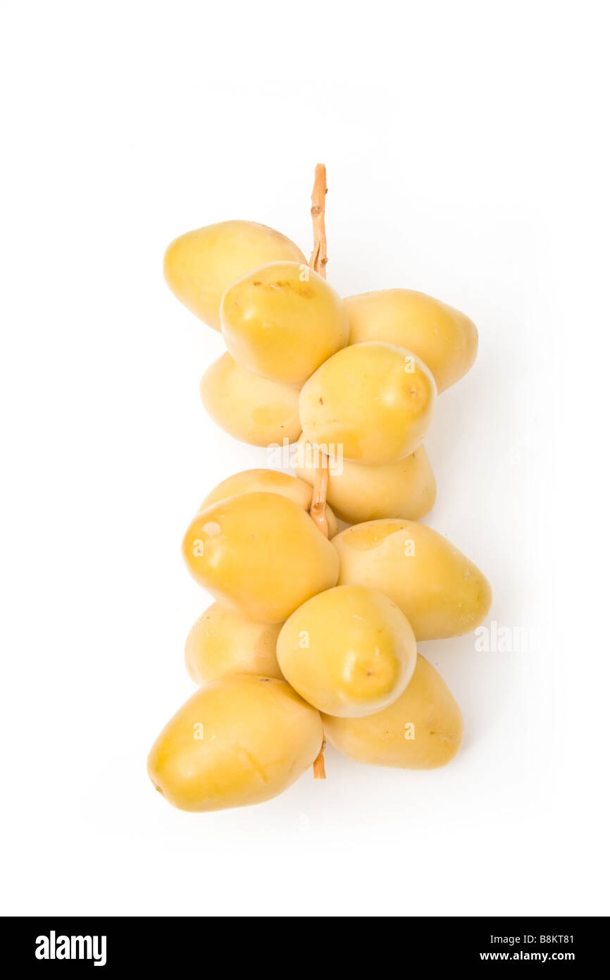 Fresh yellow dates isolated on a white studio background Stock Photo ...