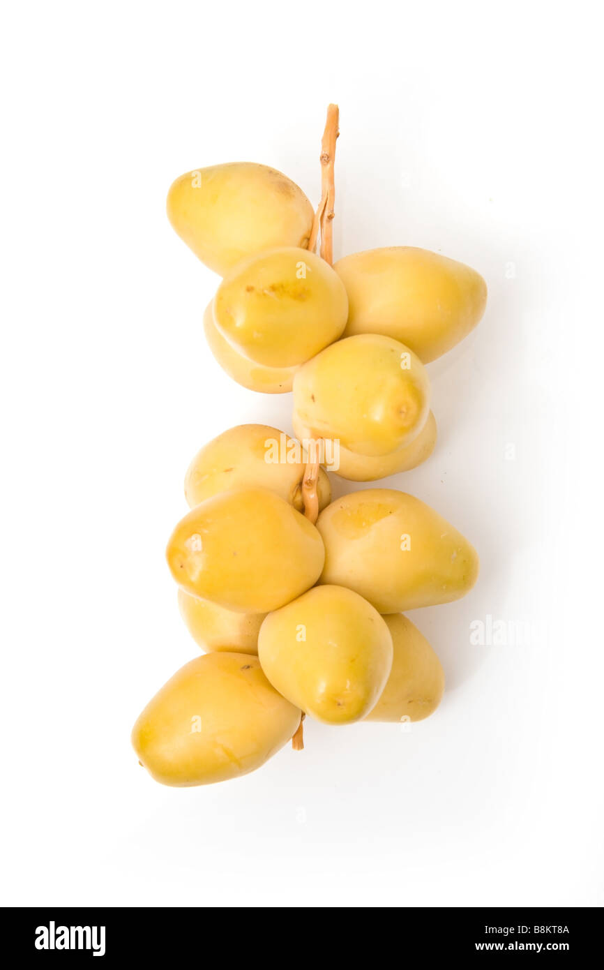 Fresh yellow dates isolated on a white studio background Stock Photo ...