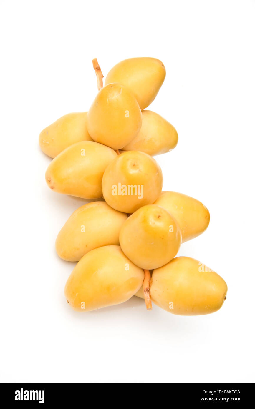 Fresh yellow dates isolated on a white studio background Stock Photo ...