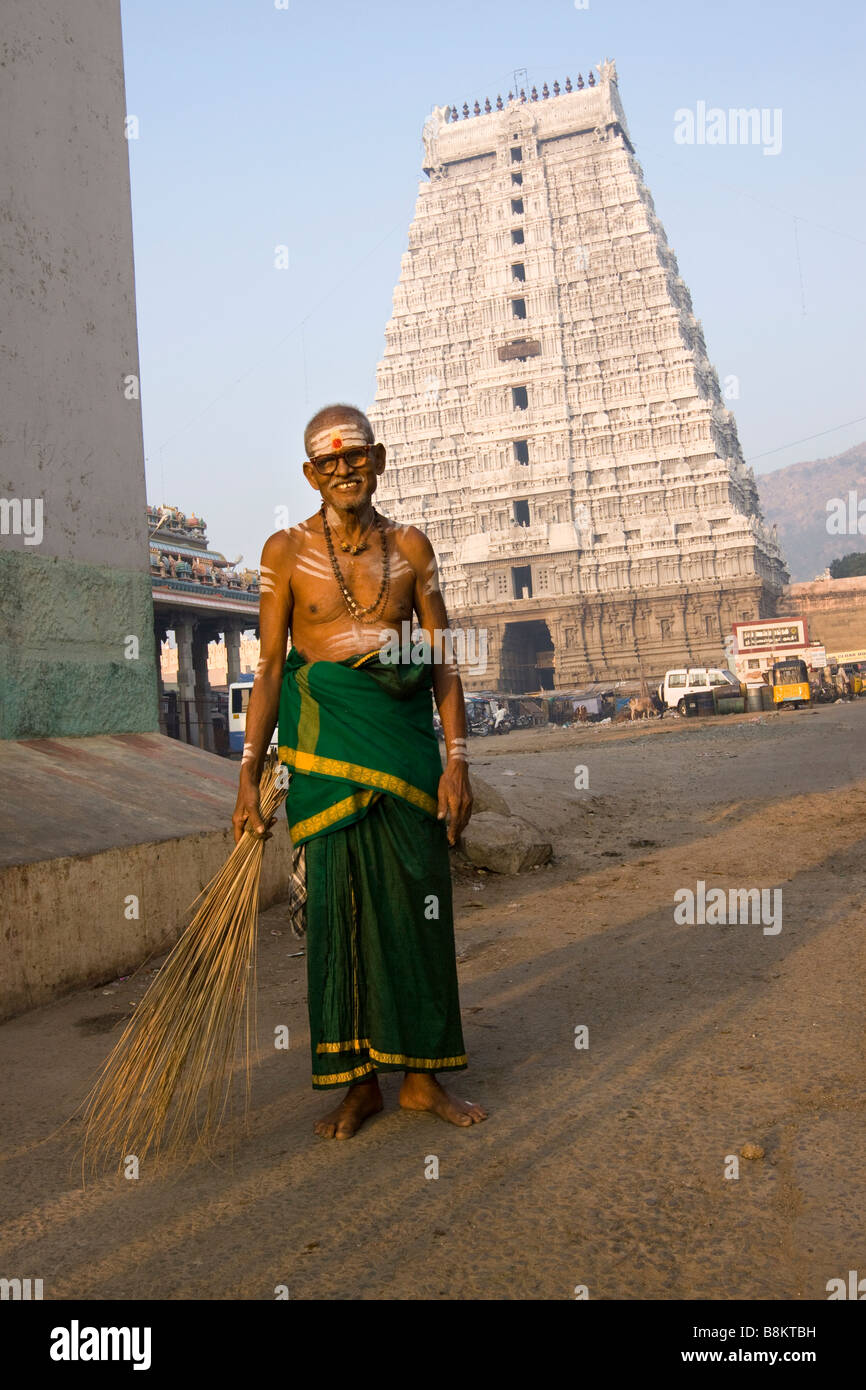 India Tamil Nadu Tiruvannamalai Brahmin priest sweeping area in front ...