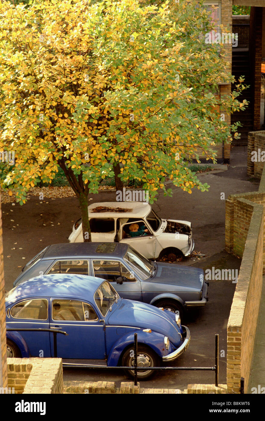 North Peckham London UK Children play in a broken car on the North ...
