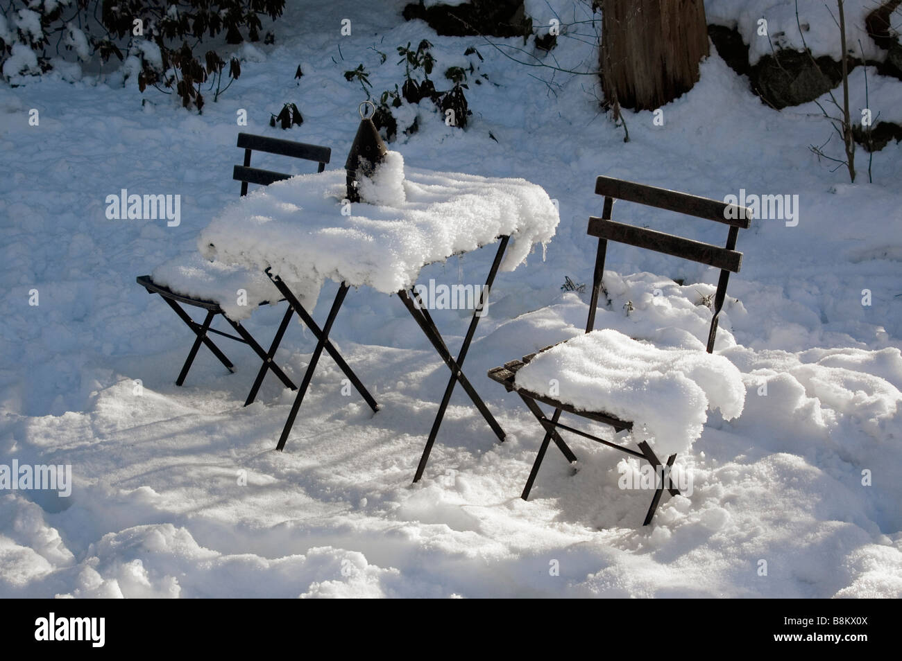 Summerfurniture embedded in snow Stock Photo - Alamy