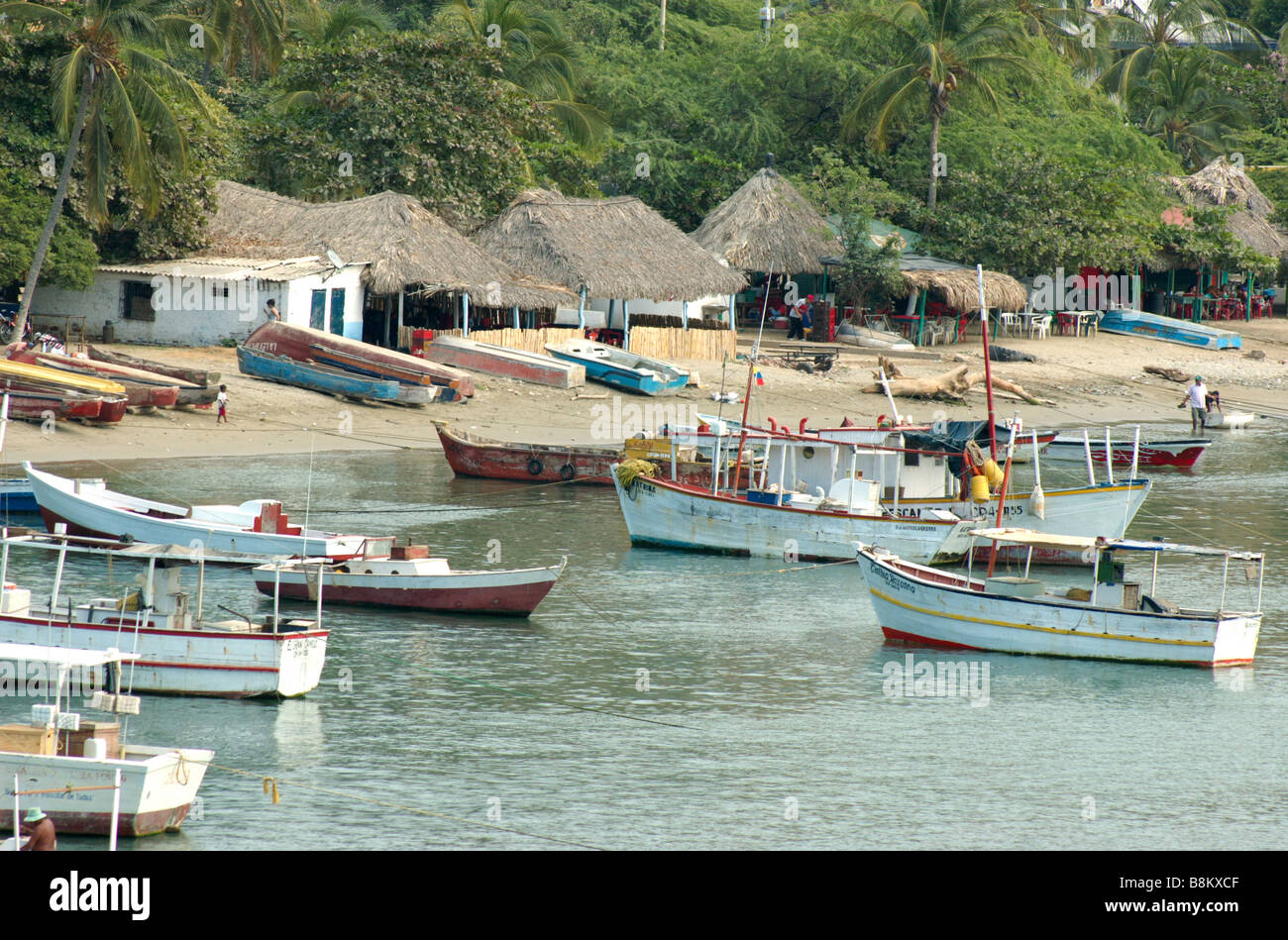 Fishing boats bobbing in the water; fishing village of Tanganga ...