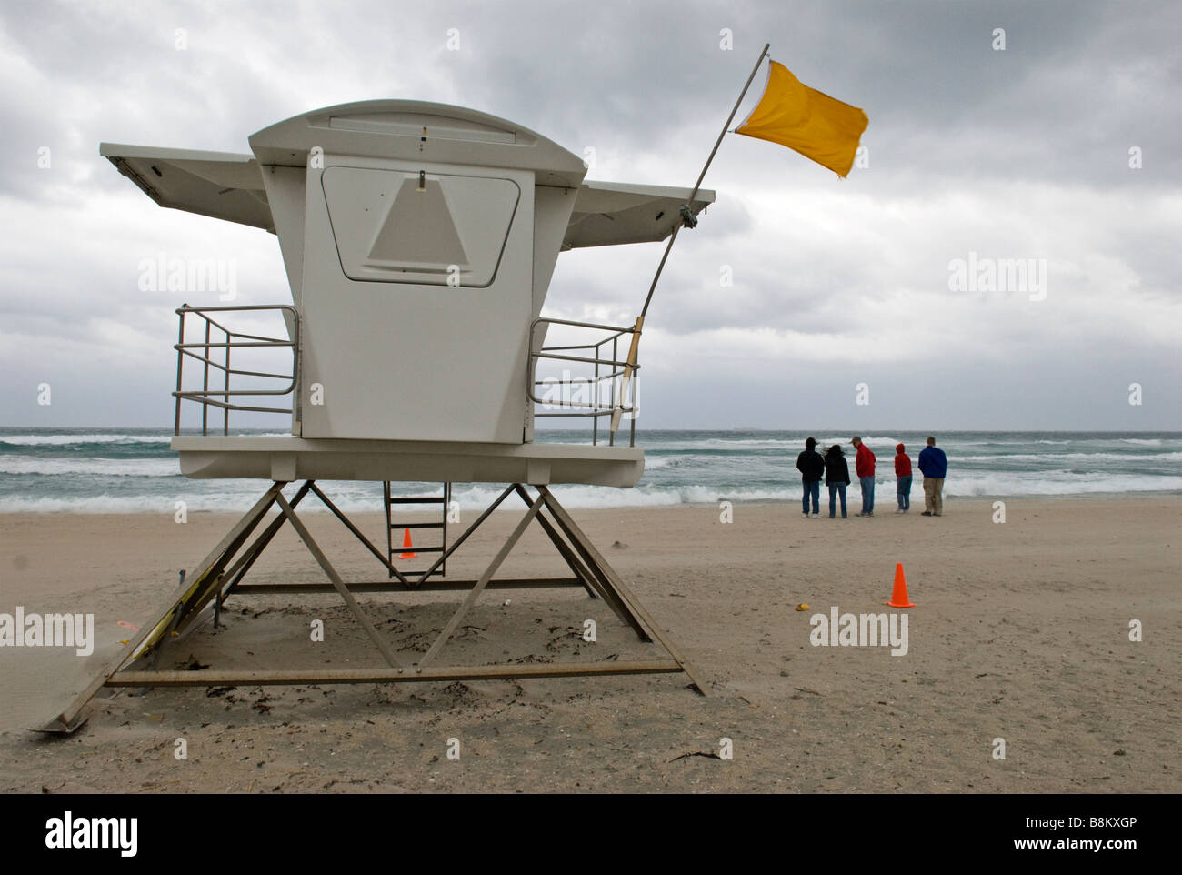 Yellow flag warning of dangerous rip tides on a Florida Beach Stock ...