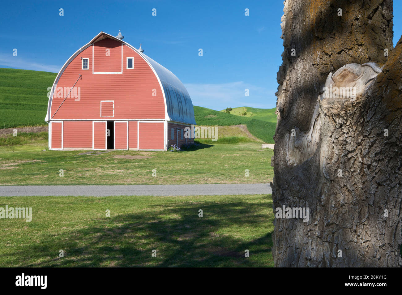 Red barn in rolling farm country of the Palouse area of eastern ...