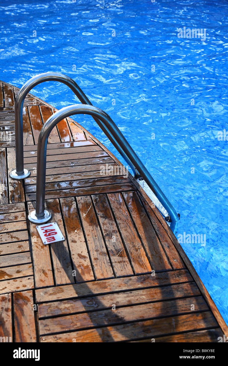 Fragment of swimming pool with a ladder and transparent water Stock ...