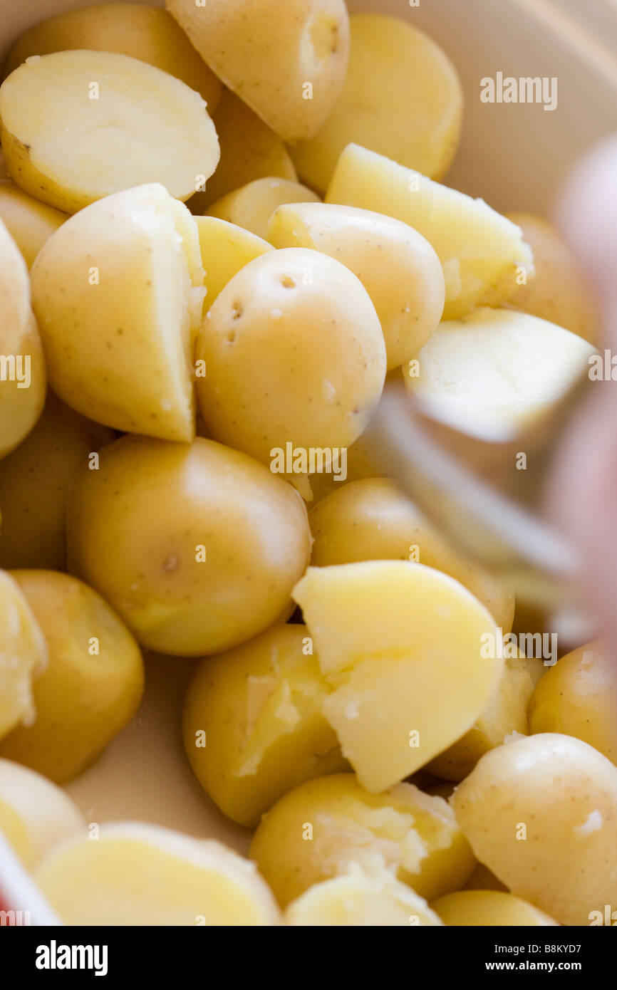 New potatoes being served from a platter Stock Photo - Alamy