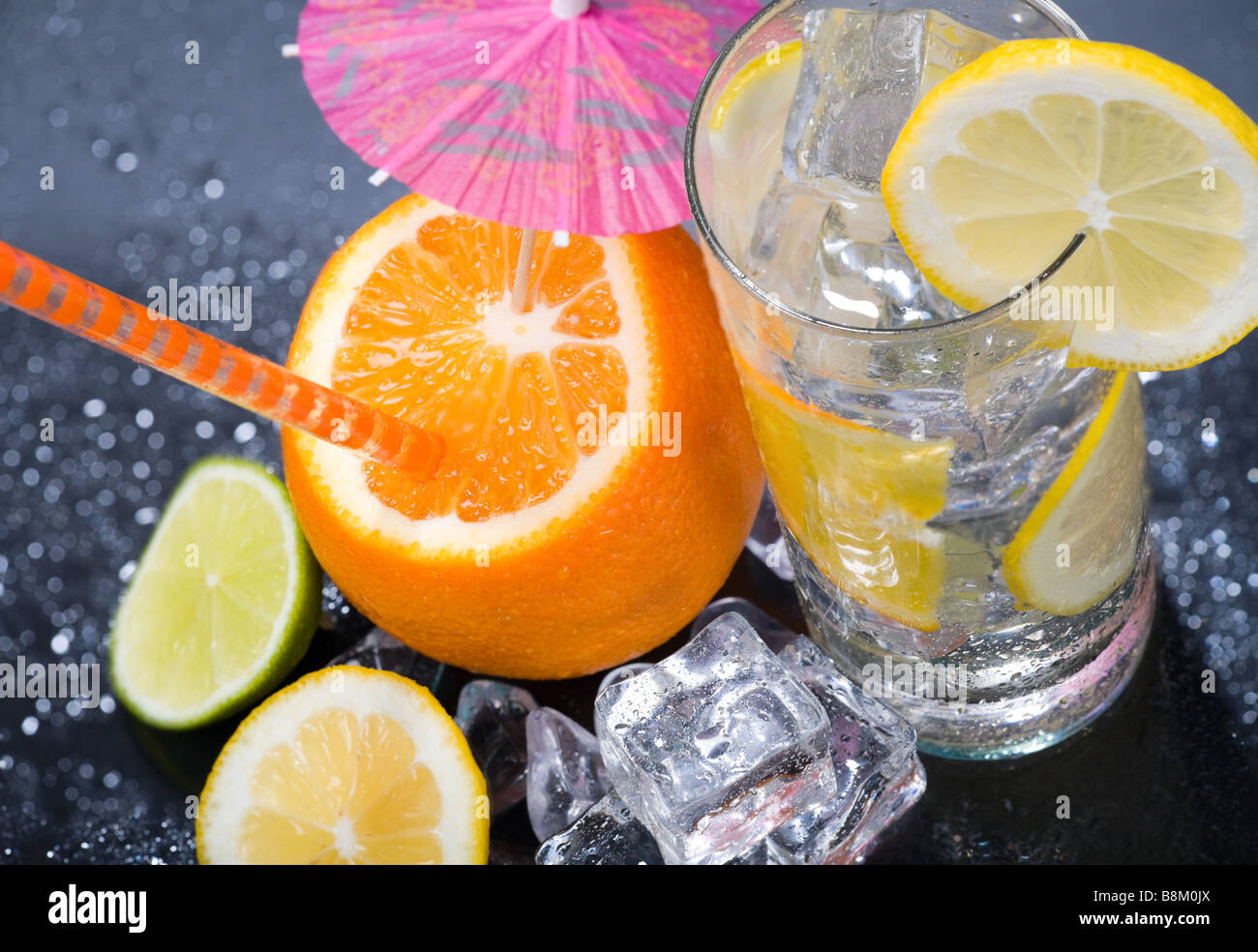 Citrus Ice Water Citrus ice water glass over dark background Stock ...