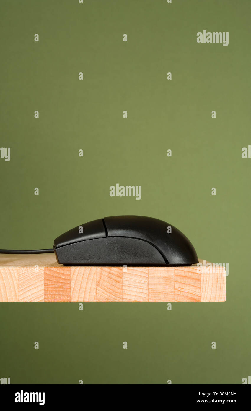 A computer mouse on a shelf Stock Photo - Alamy
