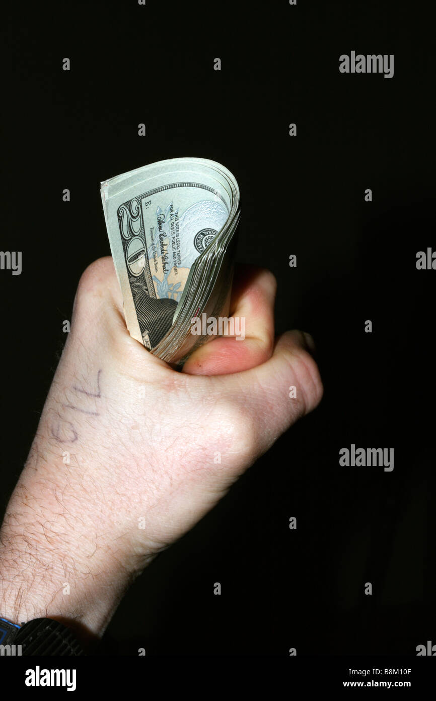Clenched fist money hi-res stock photography and images - Alamy