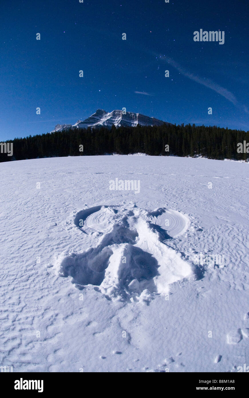 Snow angel on a frozen Johnson Lake in Banff National Park, Alberta ...