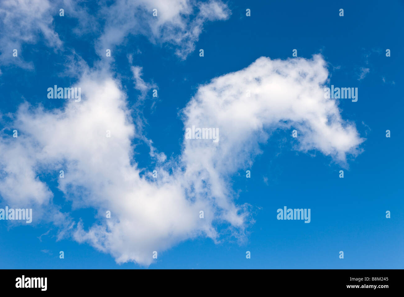 Fluffy white cloud in blue sky Stock Photo - Alamy