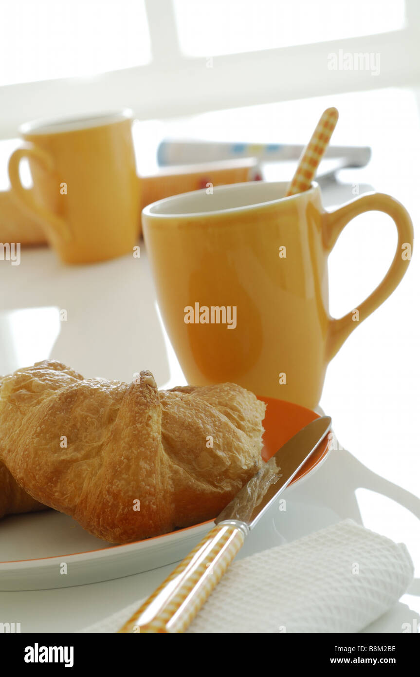 a cup and a croissant Stock Photo - Alamy