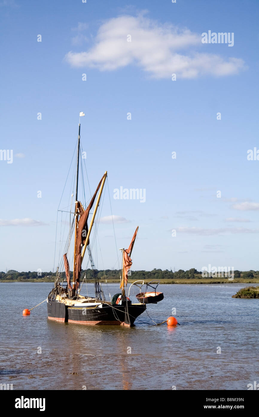 A Victorian spritsail sailing barge at anchor on the River Alde at Iken ...
