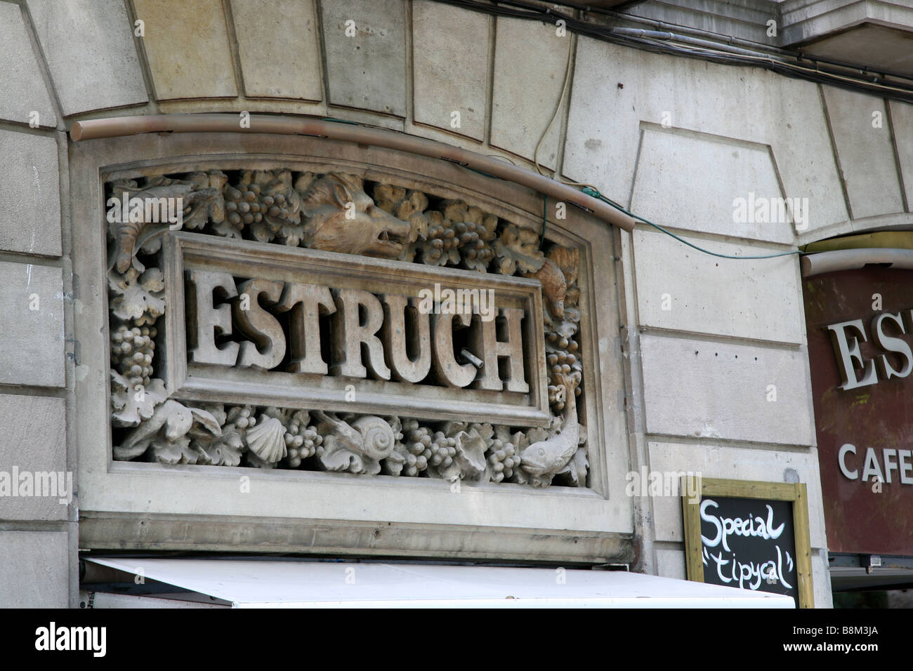A building name sign over a door in the Barri Gotic Quarter of ...