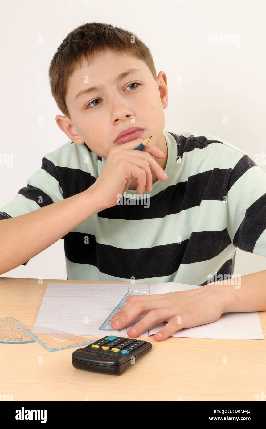 Young boy doing his homework Stock Photo - Alamy