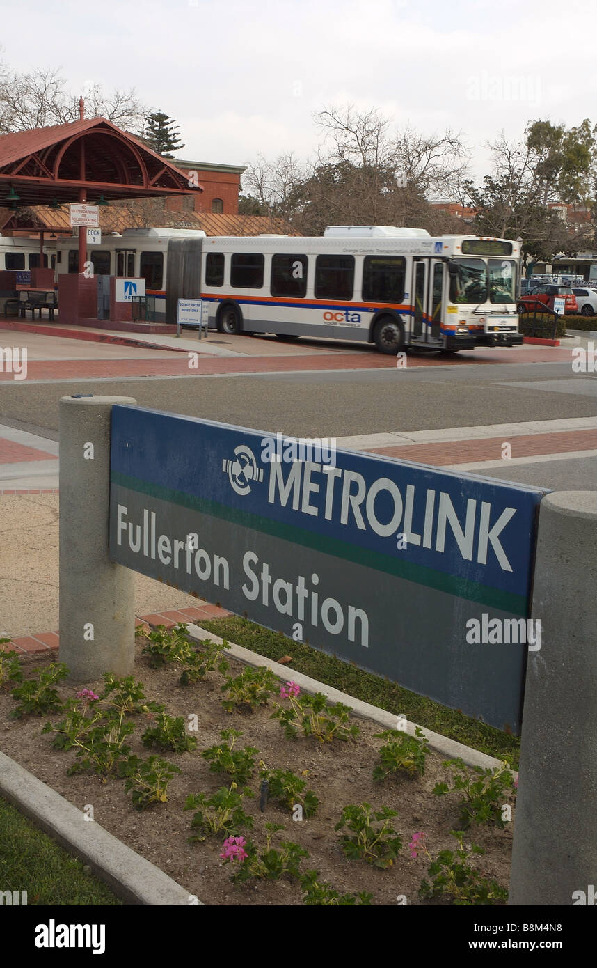 The Fullerton Station Metrolink sign with a bus in the background ...