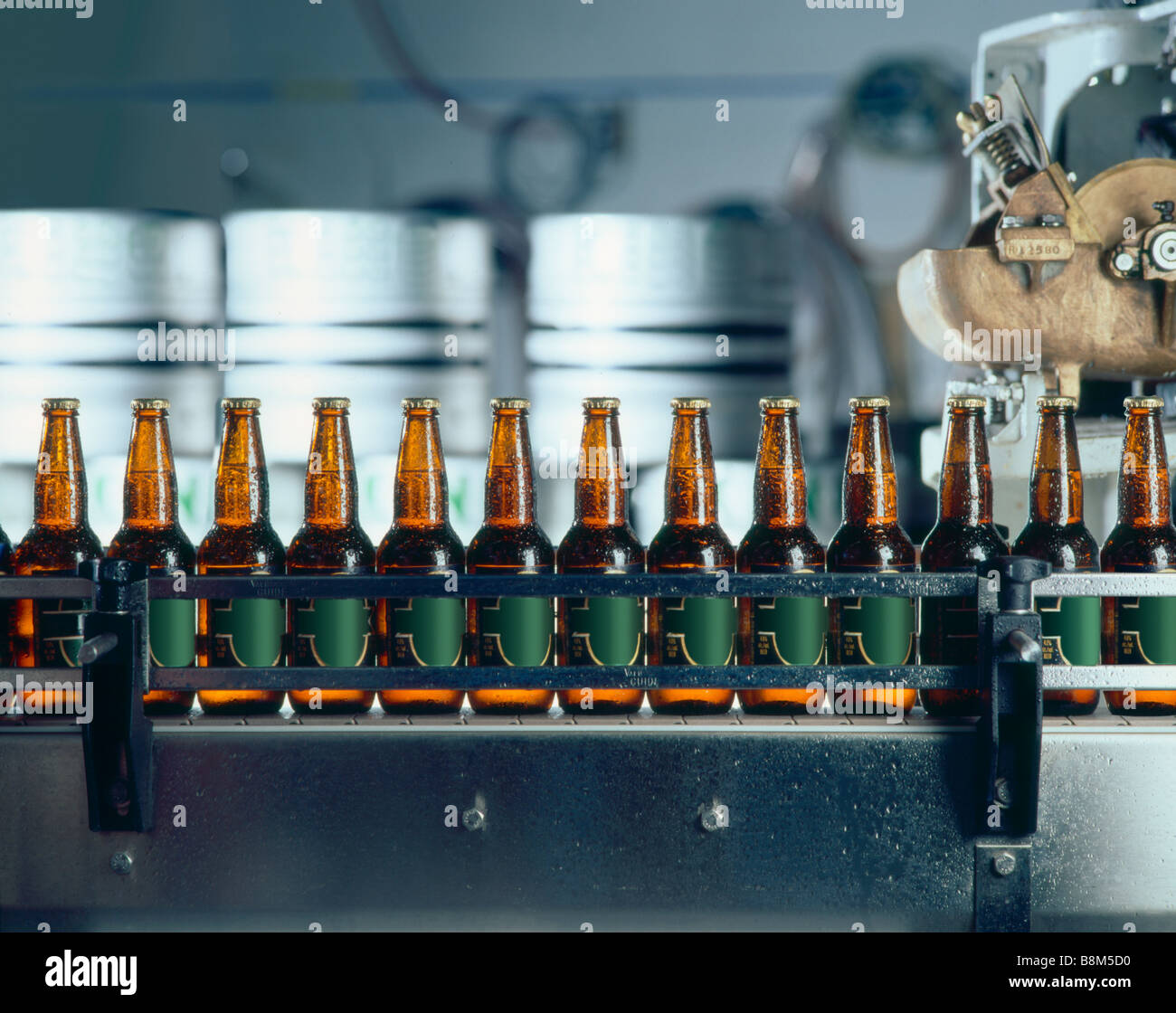 Beer bottles on a bottle line in a brewery Stock Photo - Alamy