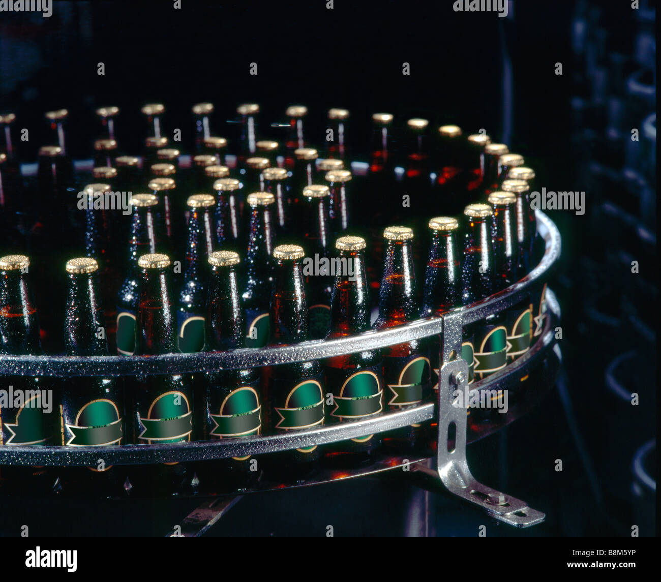 Beer bottles on the assembly line hi-res stock photography and images ...