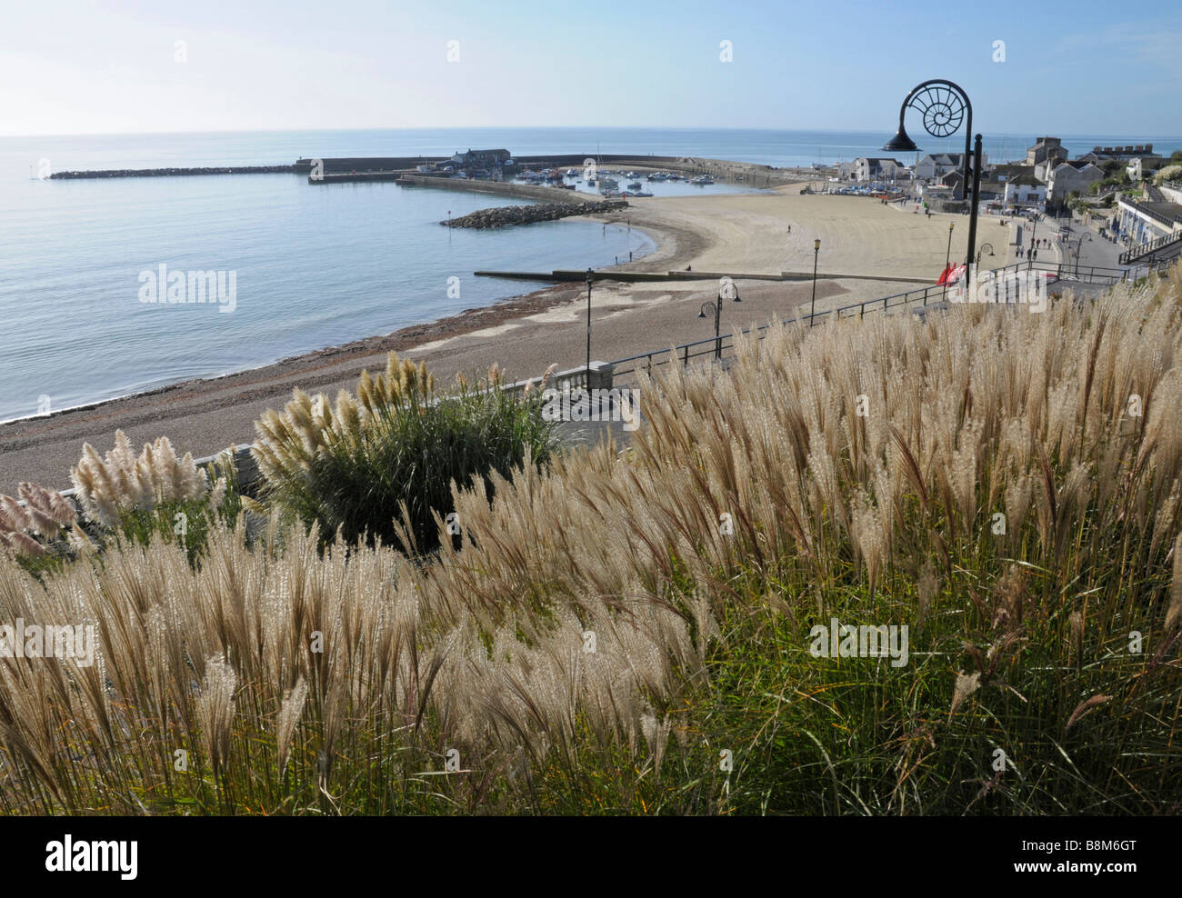 Looking towards The Cobb at Lyme Regis, Dorset, with Langmoor Gardens ...