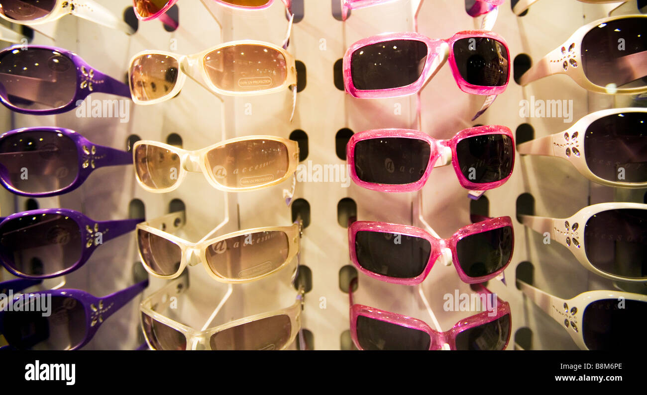 A collection of sunglasses on display for sale Stock Photo - Alamy