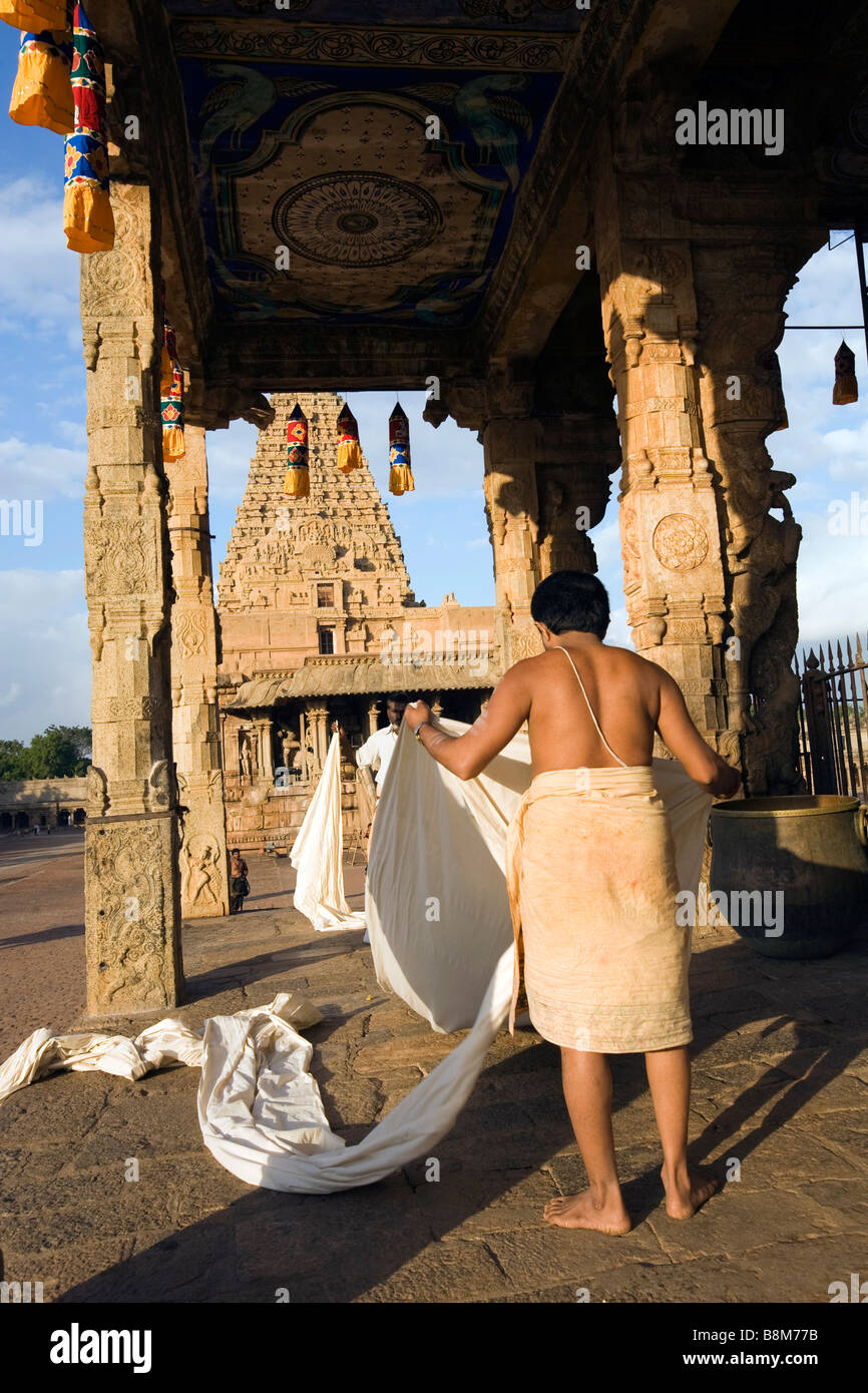 India Tamil Nadu Thanjavur Brihasdishwara temple priests folding holy ...