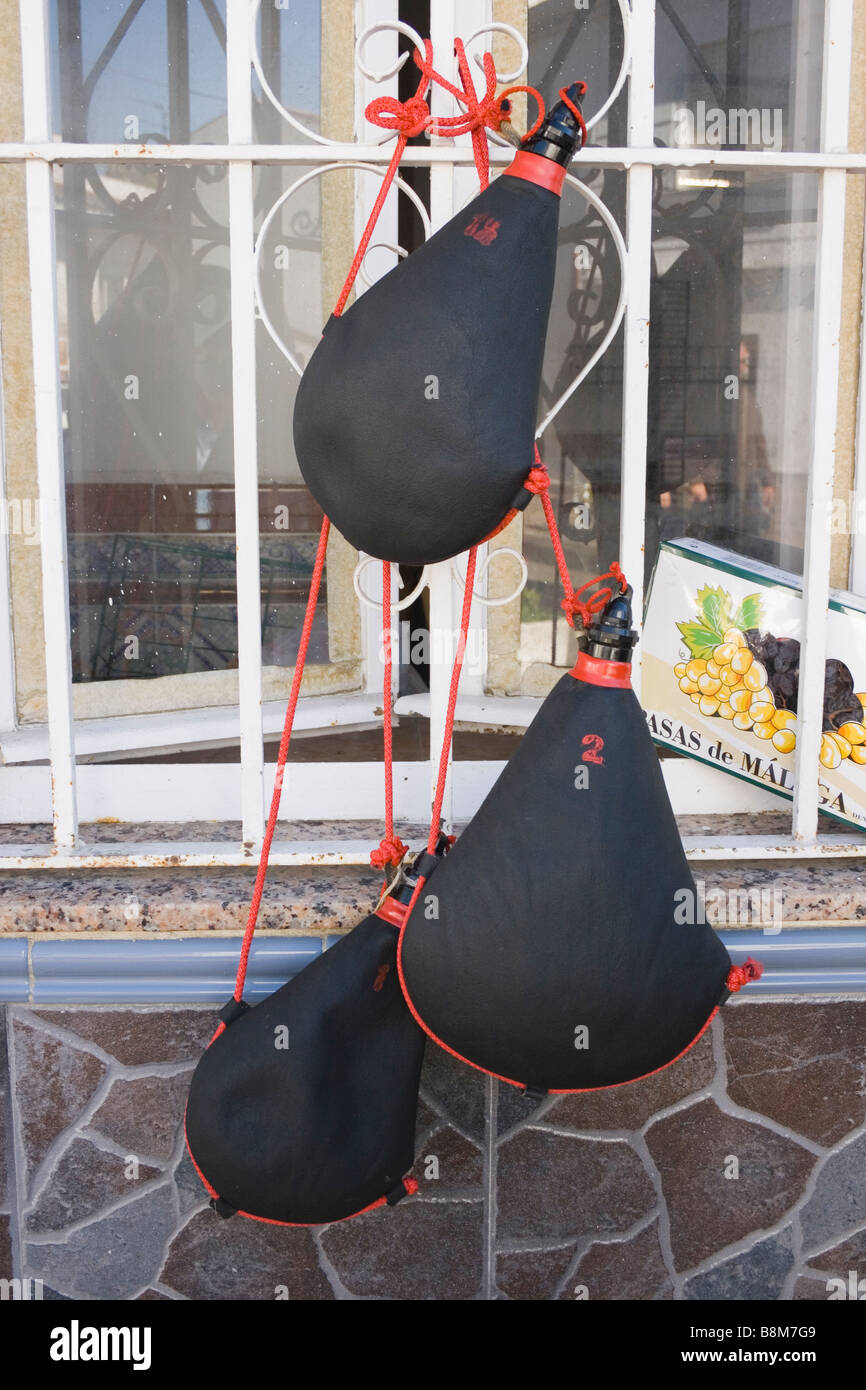Three wineskins hanging in front of window Torrox Village Malaga ...