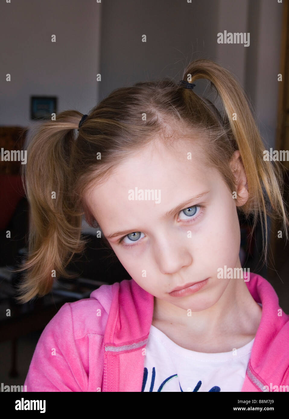 Little girl in a bad mood Stock Photo - Alamy