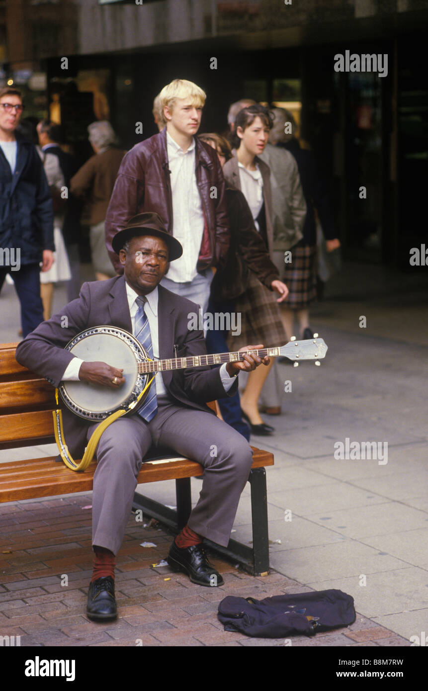 Windrush Generation a black British older man busking in Manchester ...