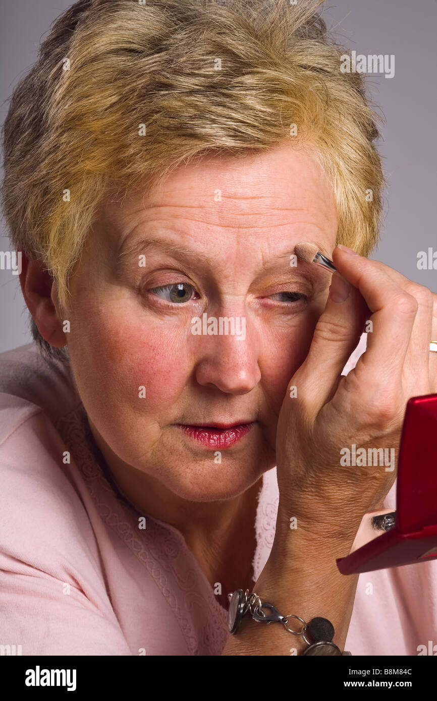 One woman cosmetics compact mirror hi-res stock photography and images ...