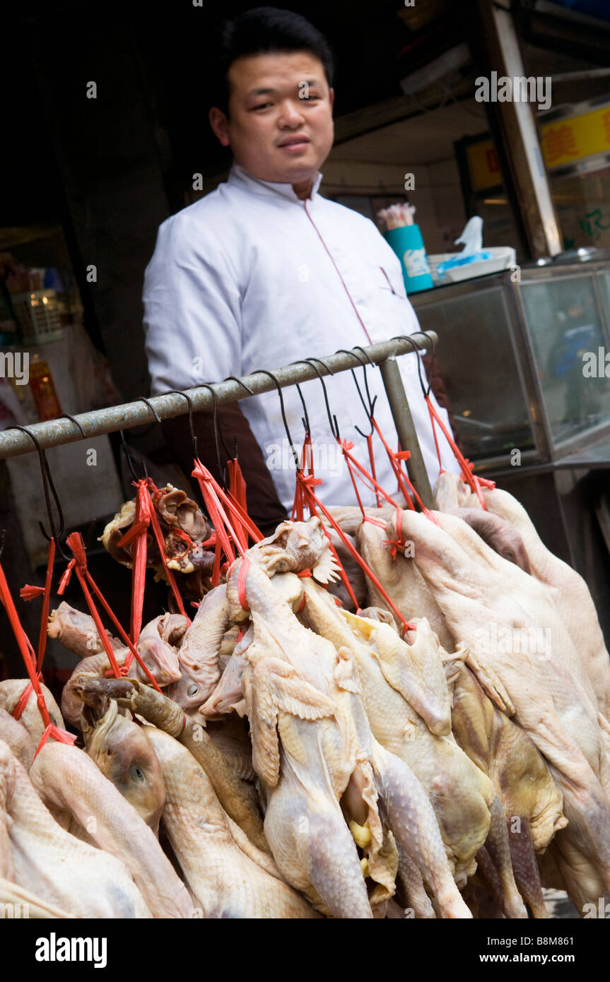 Chickens in a small market street in Nanjing. the chickens will be ...