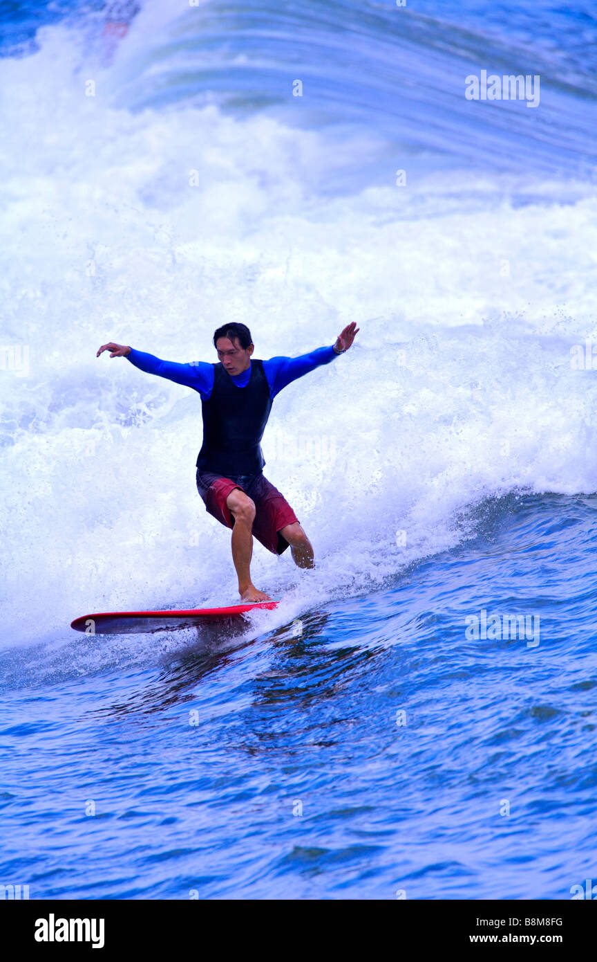 Man surfing on the sea with arms outstretched Stock Photo - Alamy