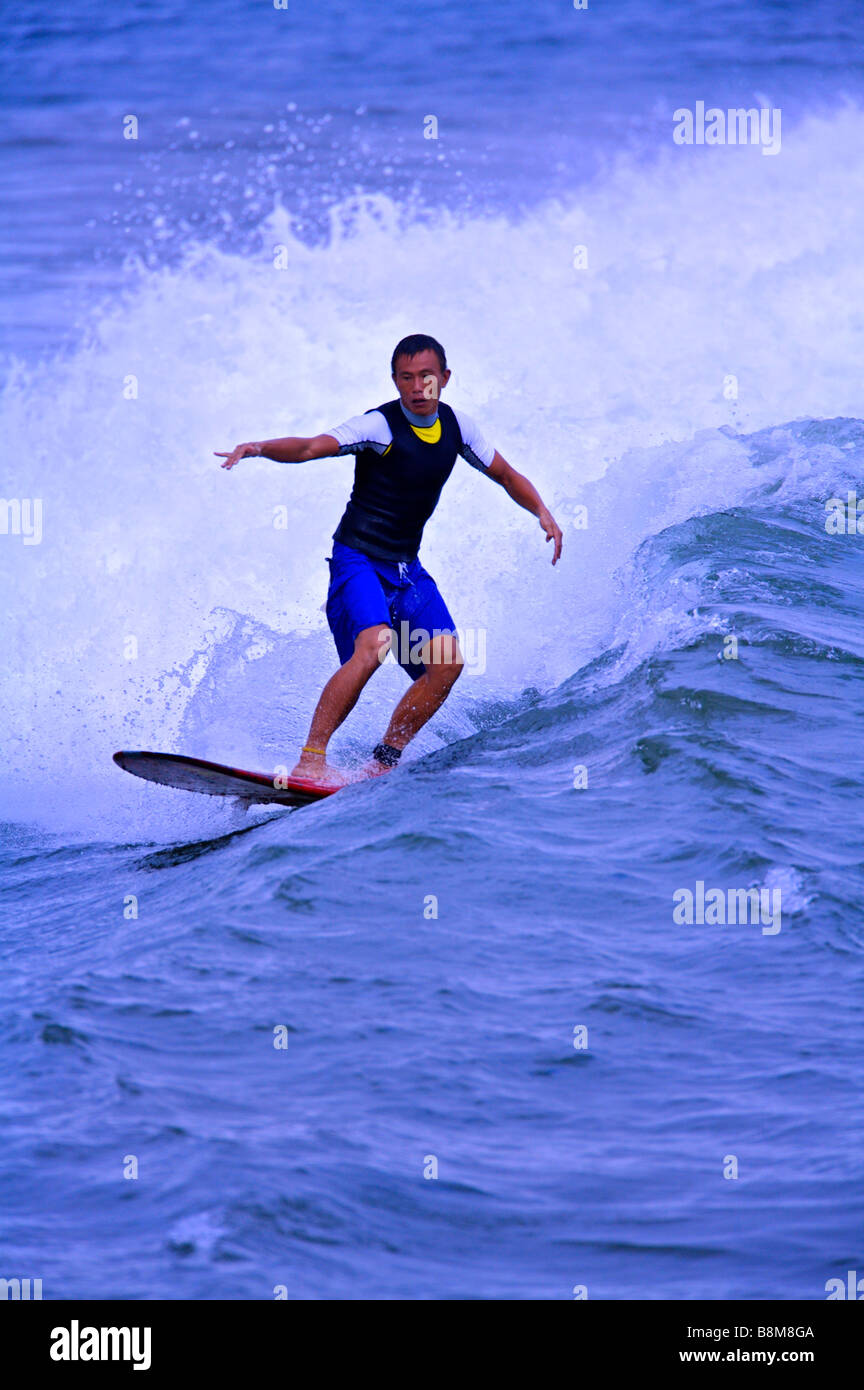 Man surfing on the sea with arms outstretched Stock Photo - Alamy