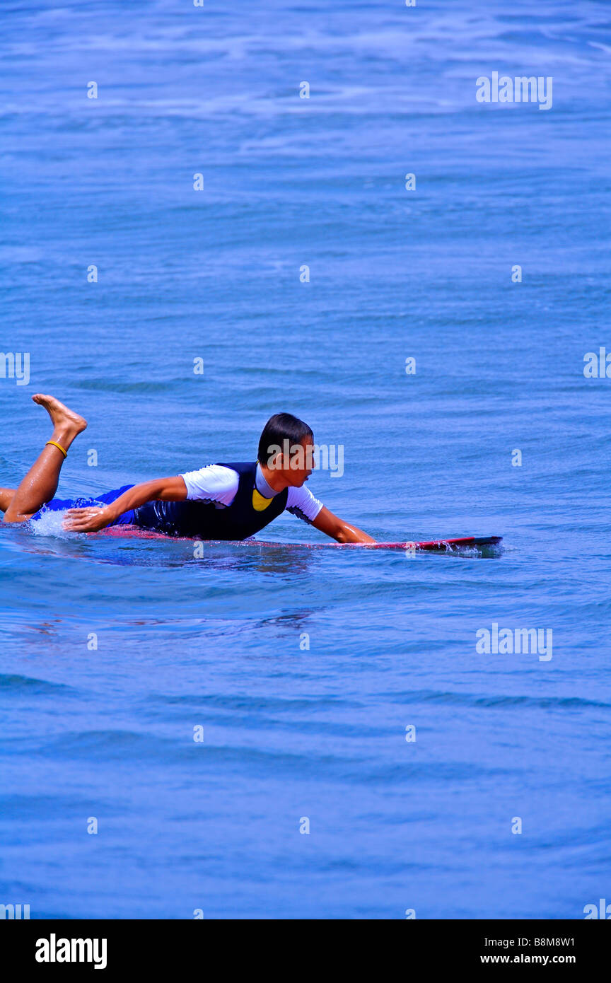 Man floating on the sea with the surfboard Stock Photo - Alamy