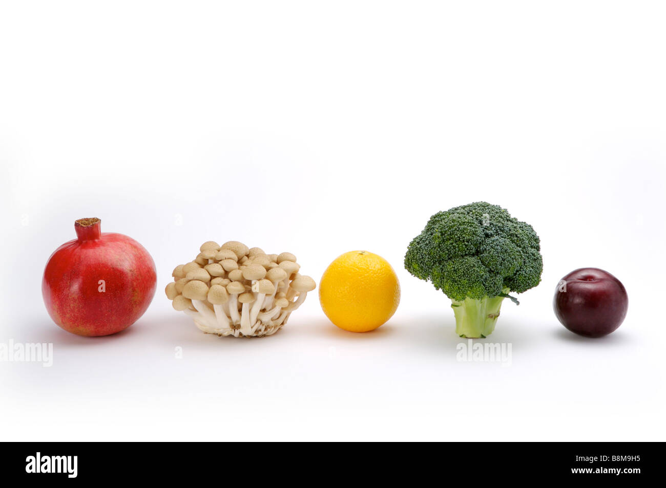 Fruits and vegetables in a row close up Stock Photo - Alamy