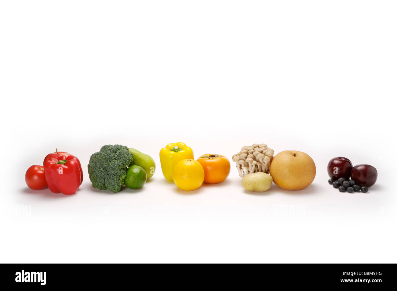 Close up of fresh fruits and vegetables in a row Stock Photo - Alamy
