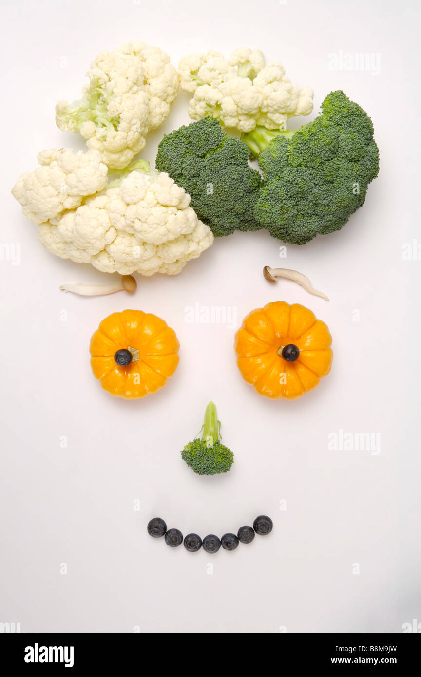 Smiley face made from different fruits and vegetables close up Stock ...