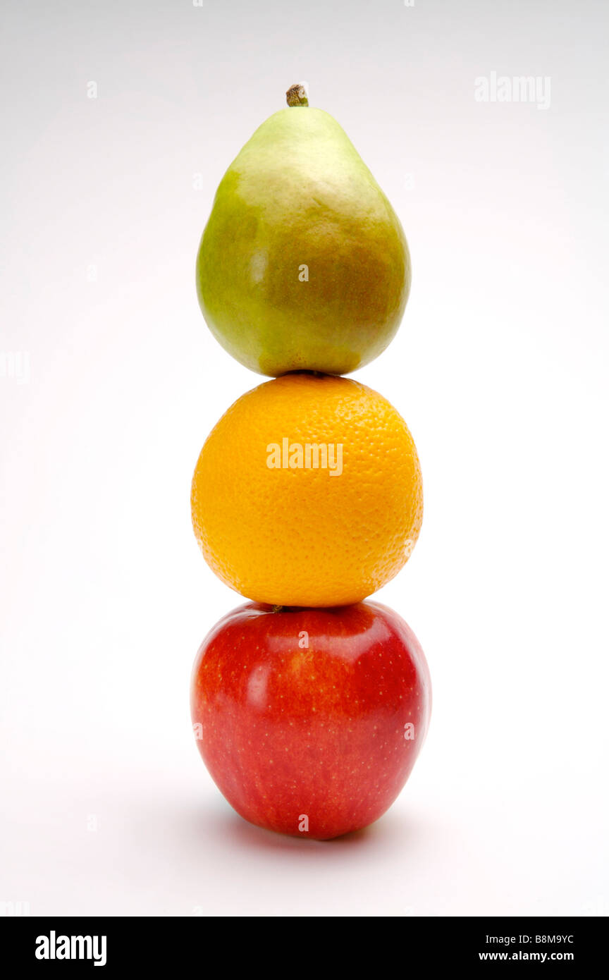 Stack of three fruits in a row close up Stock Photo - Alamy